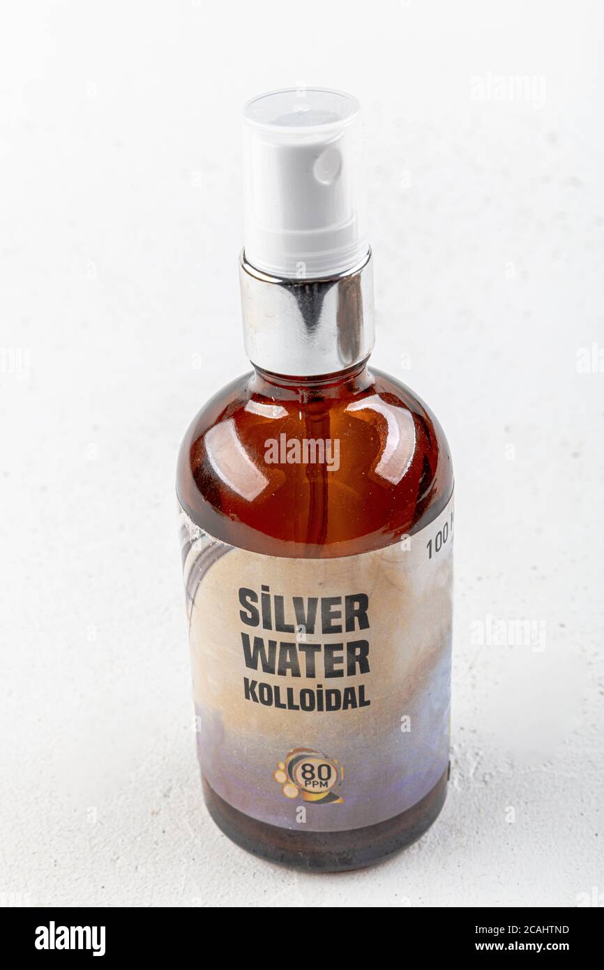 Bottle of colloidal water (Silver water) isolated on white background ...