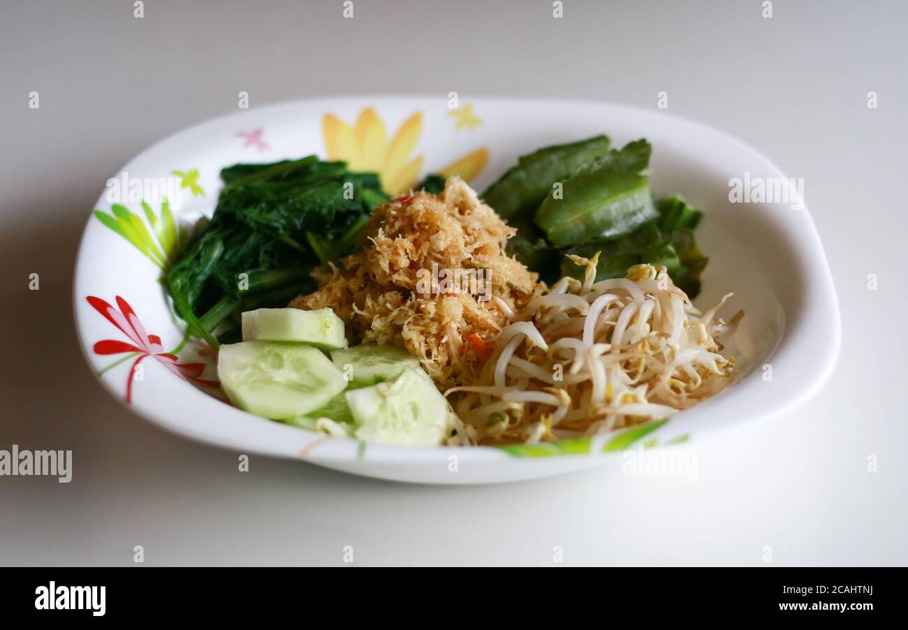 Sayur urap. Cooked vegetables with spiced grated coconut. Indonesian ...