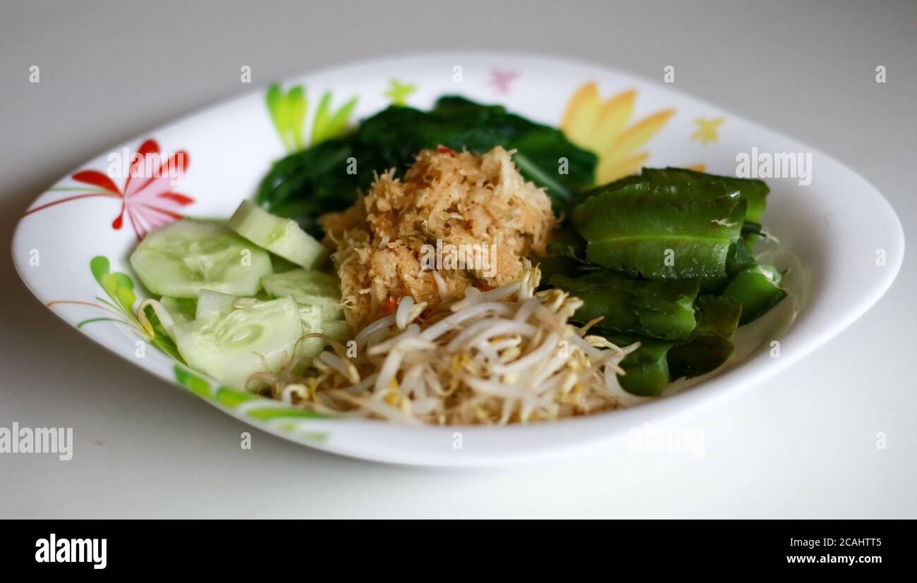 Sayur urap. Cooked vegetables with spiced grated coconut. Indonesian ...