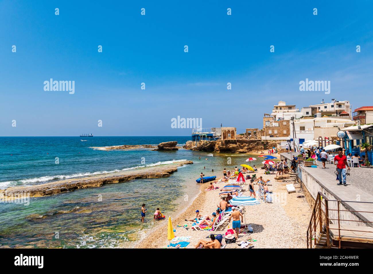BATROUN, LEBANON - Jun 02, 2019: Tourists and locals enjoying the beach ...