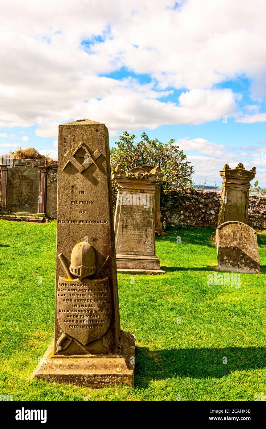 Decorated old gravestones eroded by wind, rain and sunshine but some ...