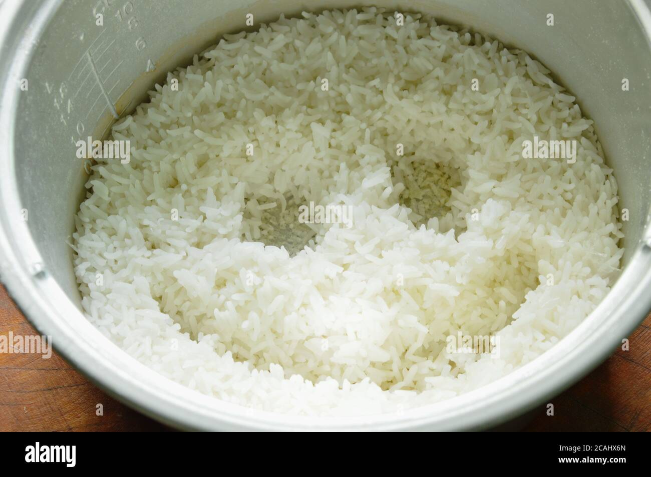 rice with smiling face in electric cooker pot Stock Photo - Alamy