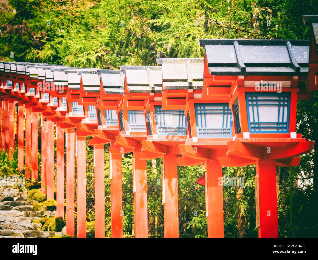 Closeup shot of red light poles continued staircase entrance Kibune ...