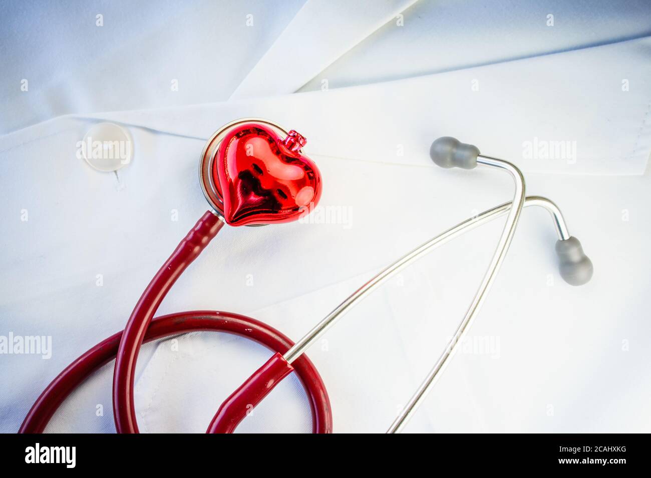 Stethoscope and decorative red heart on a white doctor's overall Stock ...