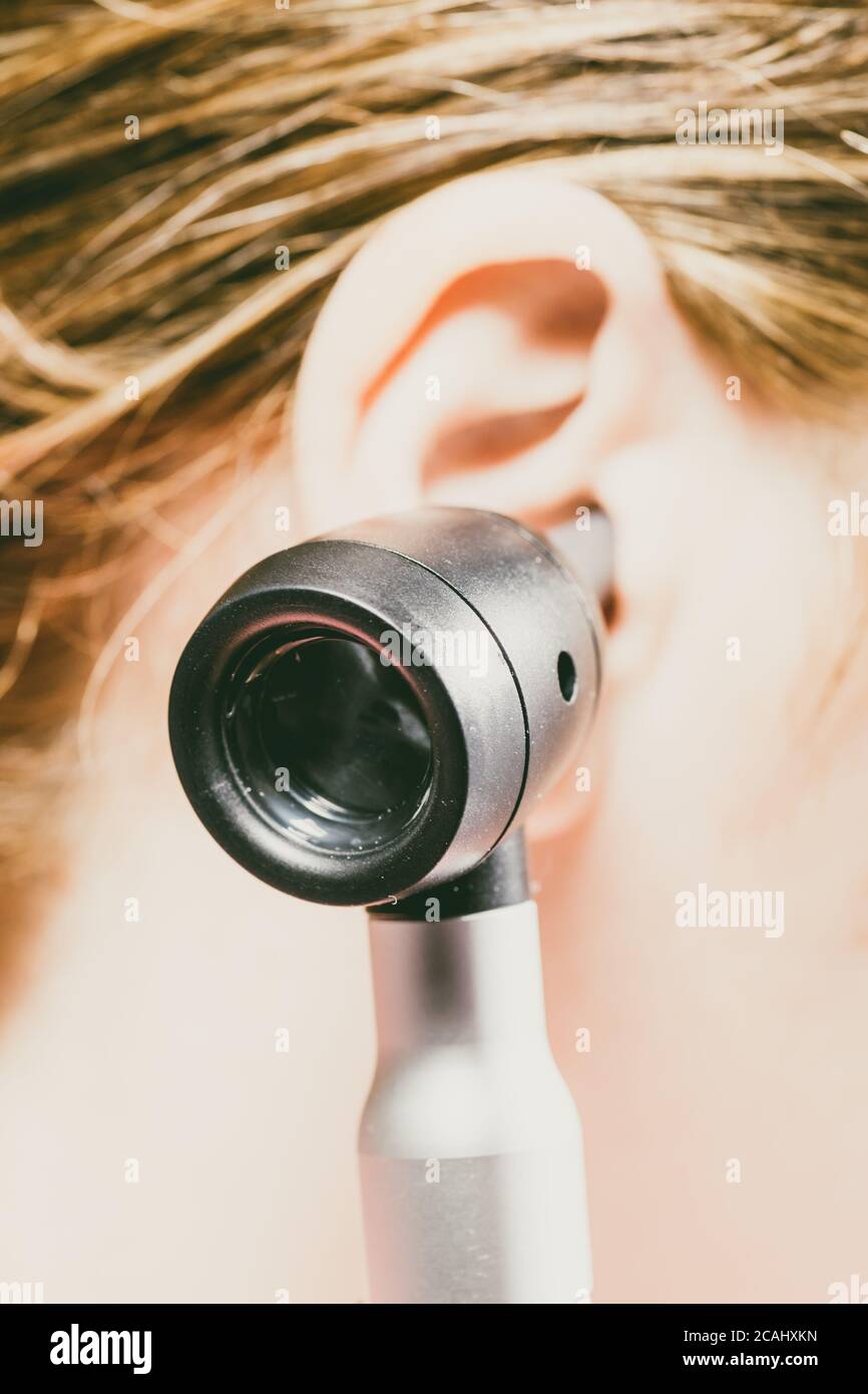 Closeup shot of a person using an otoscope for medical inspection Stock ...