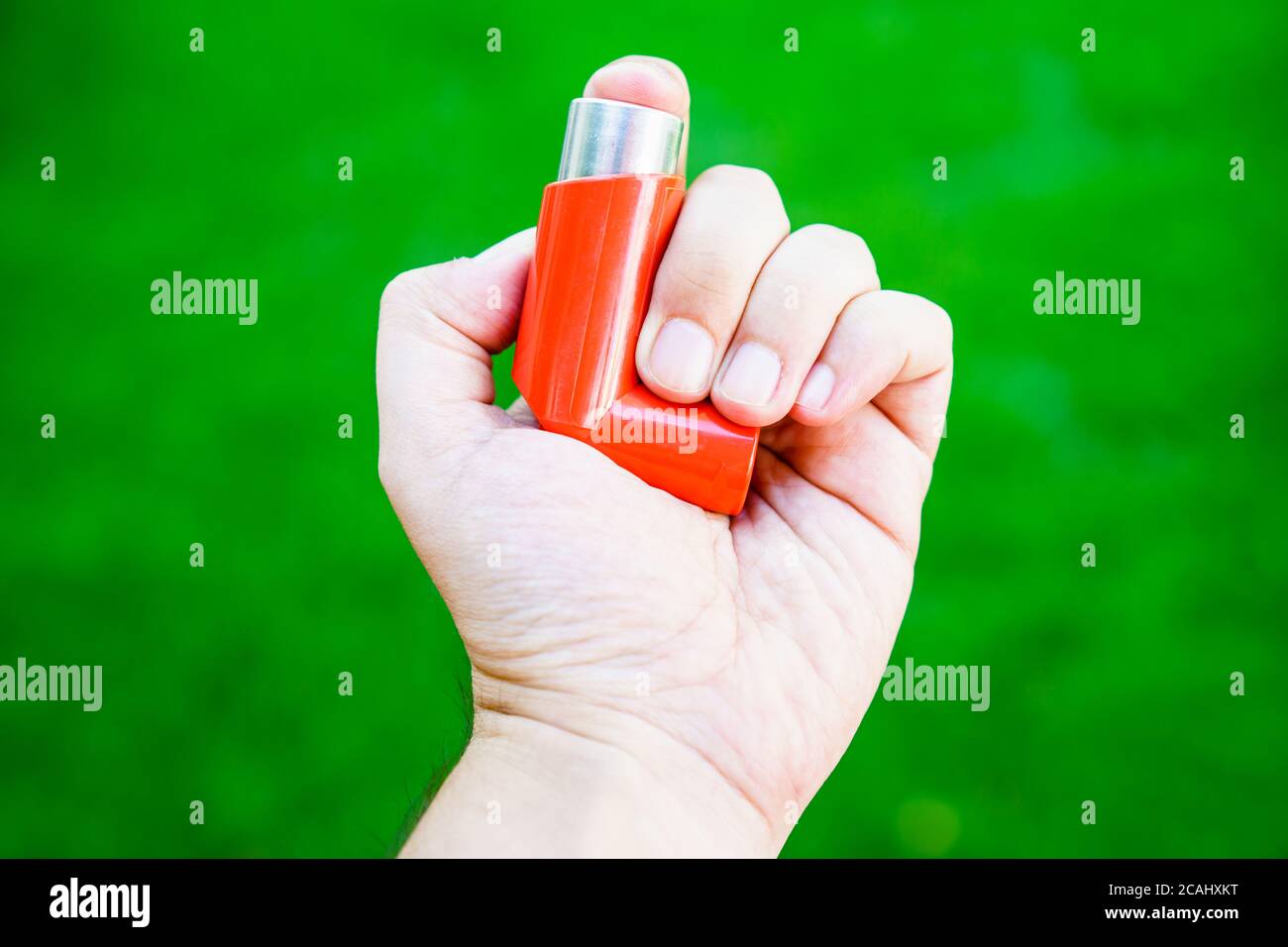 Closeup shot of a red asthma inhaler Stock Photo - Alamy