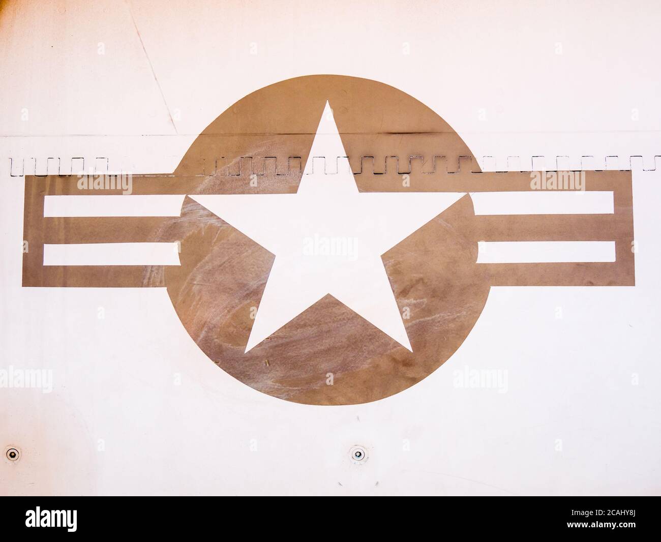 Closeup shot of the star shaped US air force symbol on a white surface ...