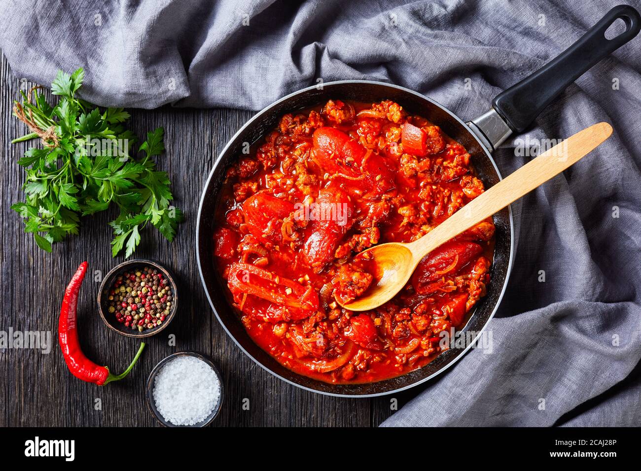 ragout with whole plum tomatoes, onion slices, ground italian pork ...