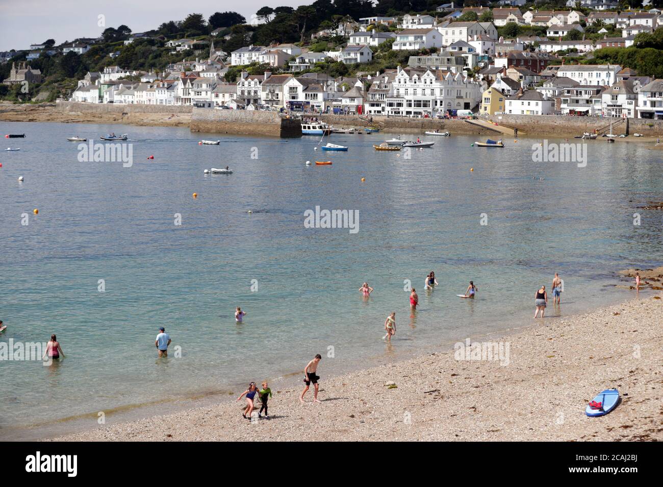 People on the beach at St Mawes, Cornwall, as the warm weather ...