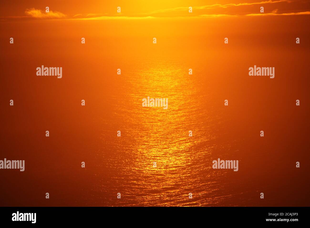 Total orange sunset over Irish Sea Stock Photo - Alamy