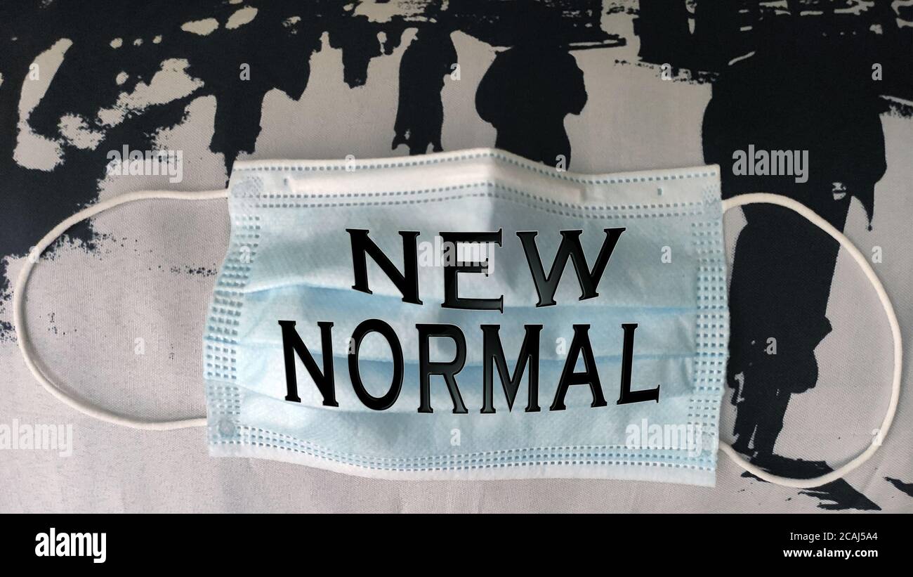 Surgical mask with the text NEW NORMAL written on it Stock Photo - Alamy
