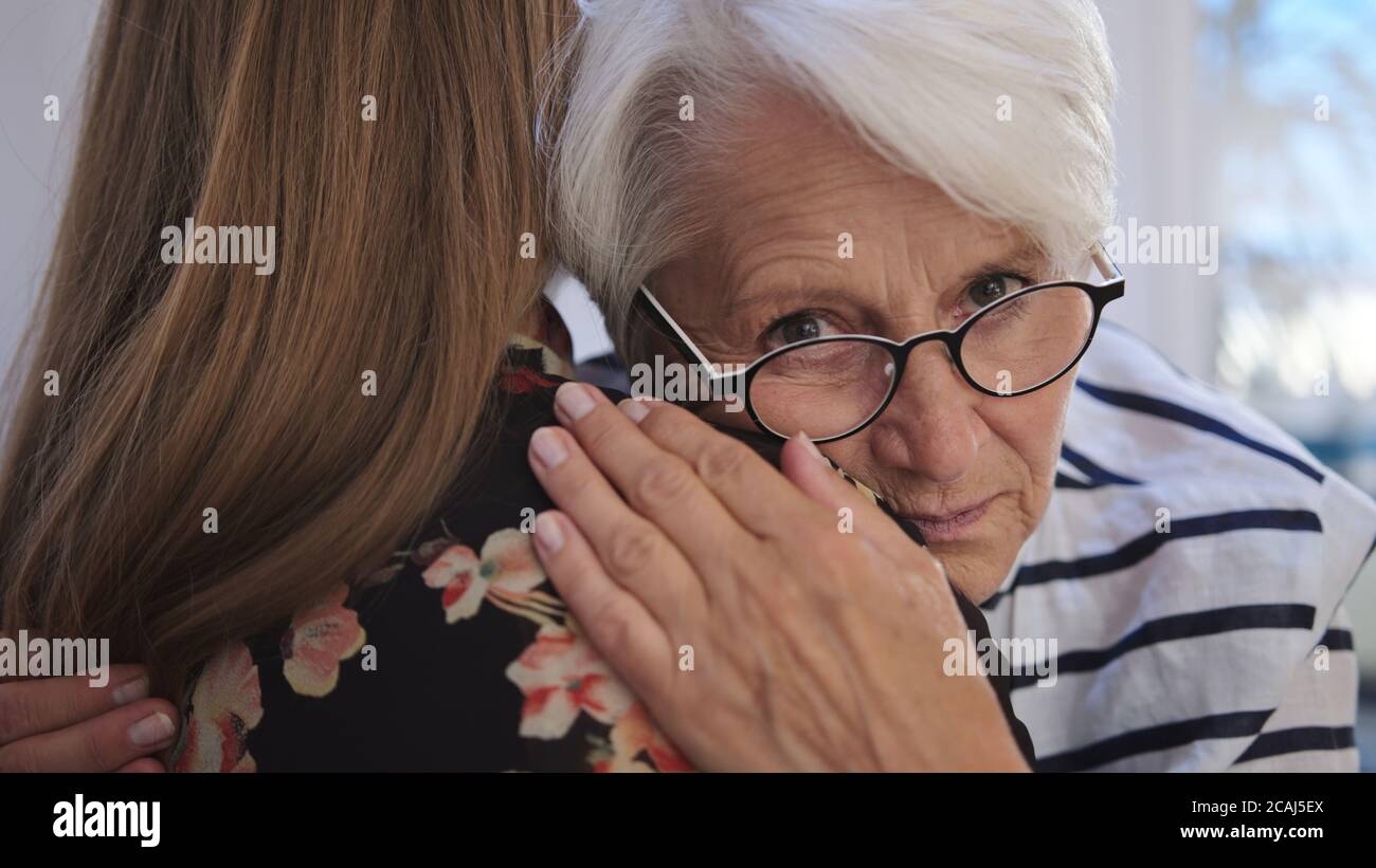 Grandmother embrace upset worried granddaughter. Empathy concept. High ...