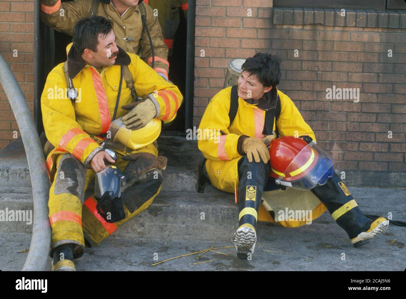 College Station Texas USA: Female and male firefighters wearing their ...