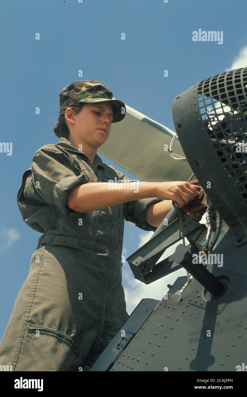 Female U.S. Army aviation mechanic working on military plane. ©Bob ...