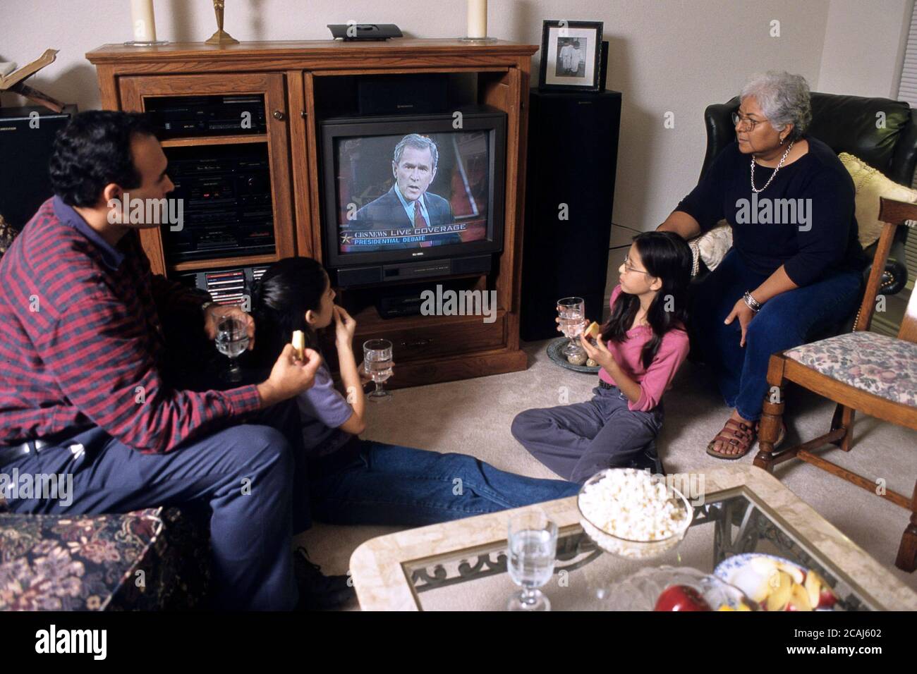 Three generations family watching tv hi-res stock photography and ...