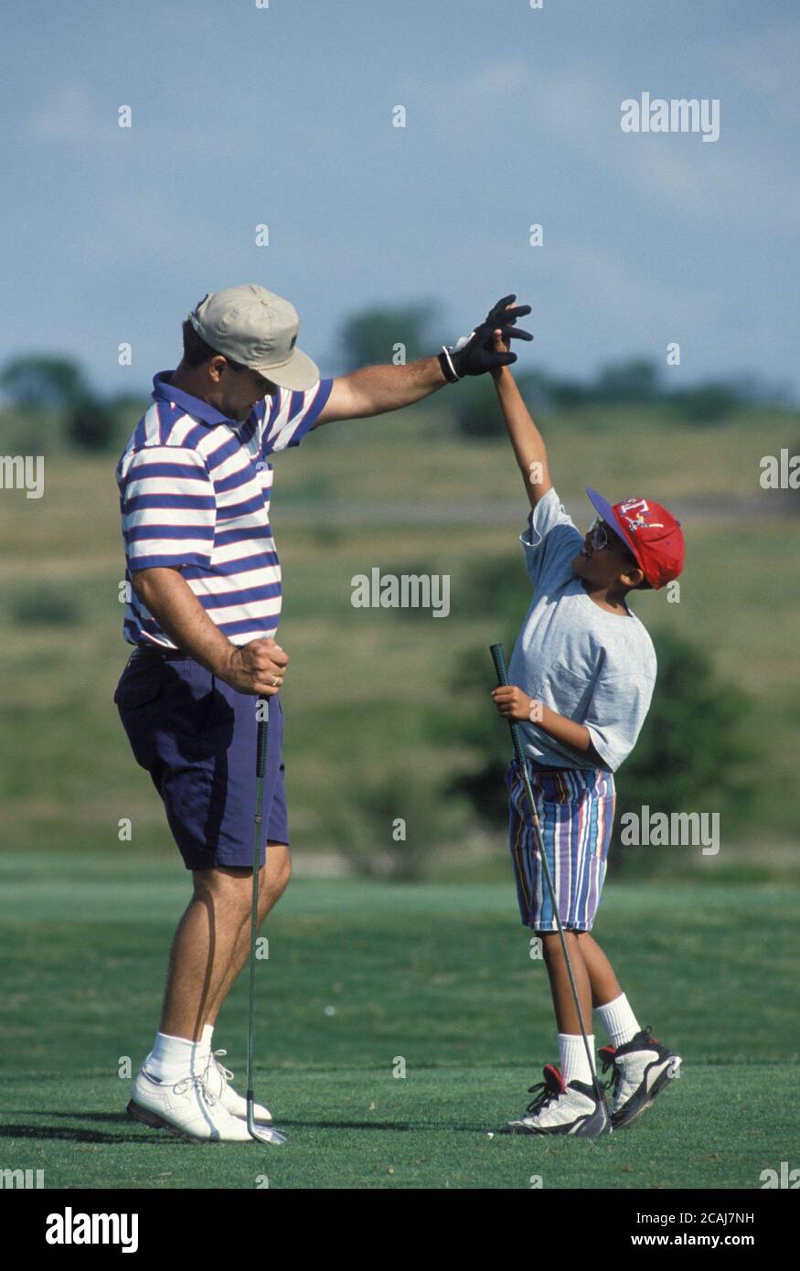 Father and son playing golf hi-res stock photography and images - Alamy