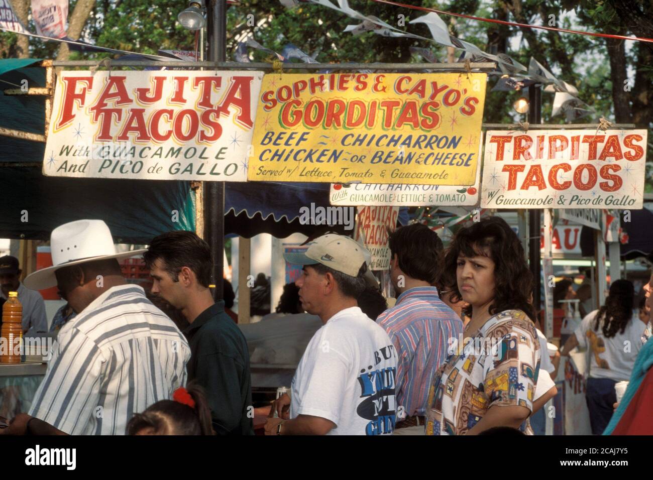 Customers line up for food from Mexican and Tex-Mex from vendors at a ...