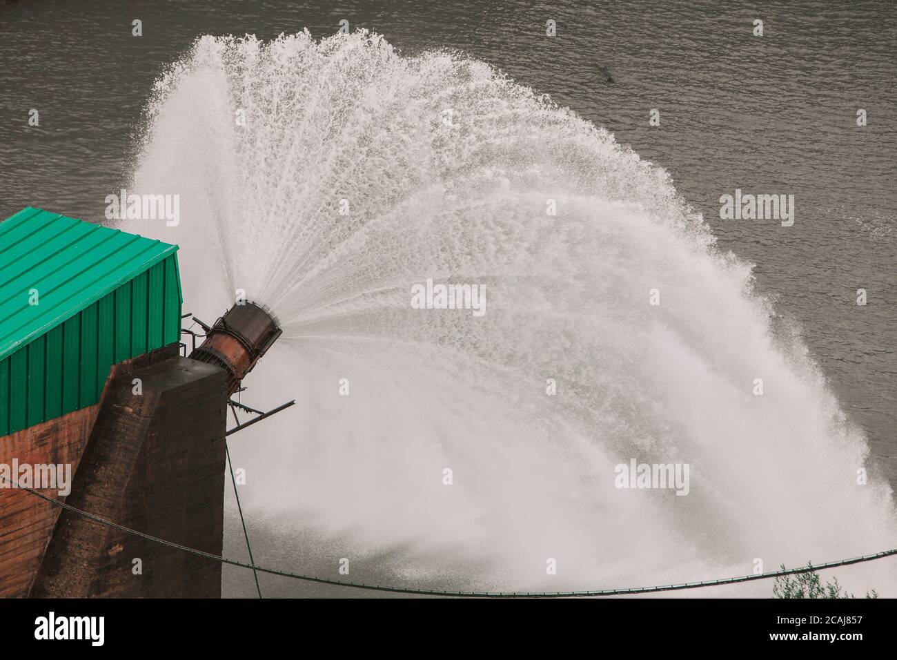 Strong jet of water pumped through a pipe Stock Photo - Alamy