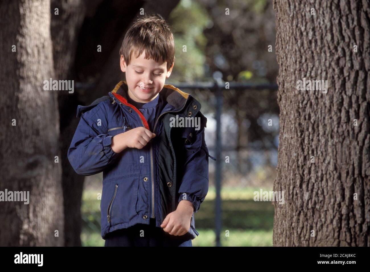 Boy zipping up his jacket hi-res stock photography and images - Alamy