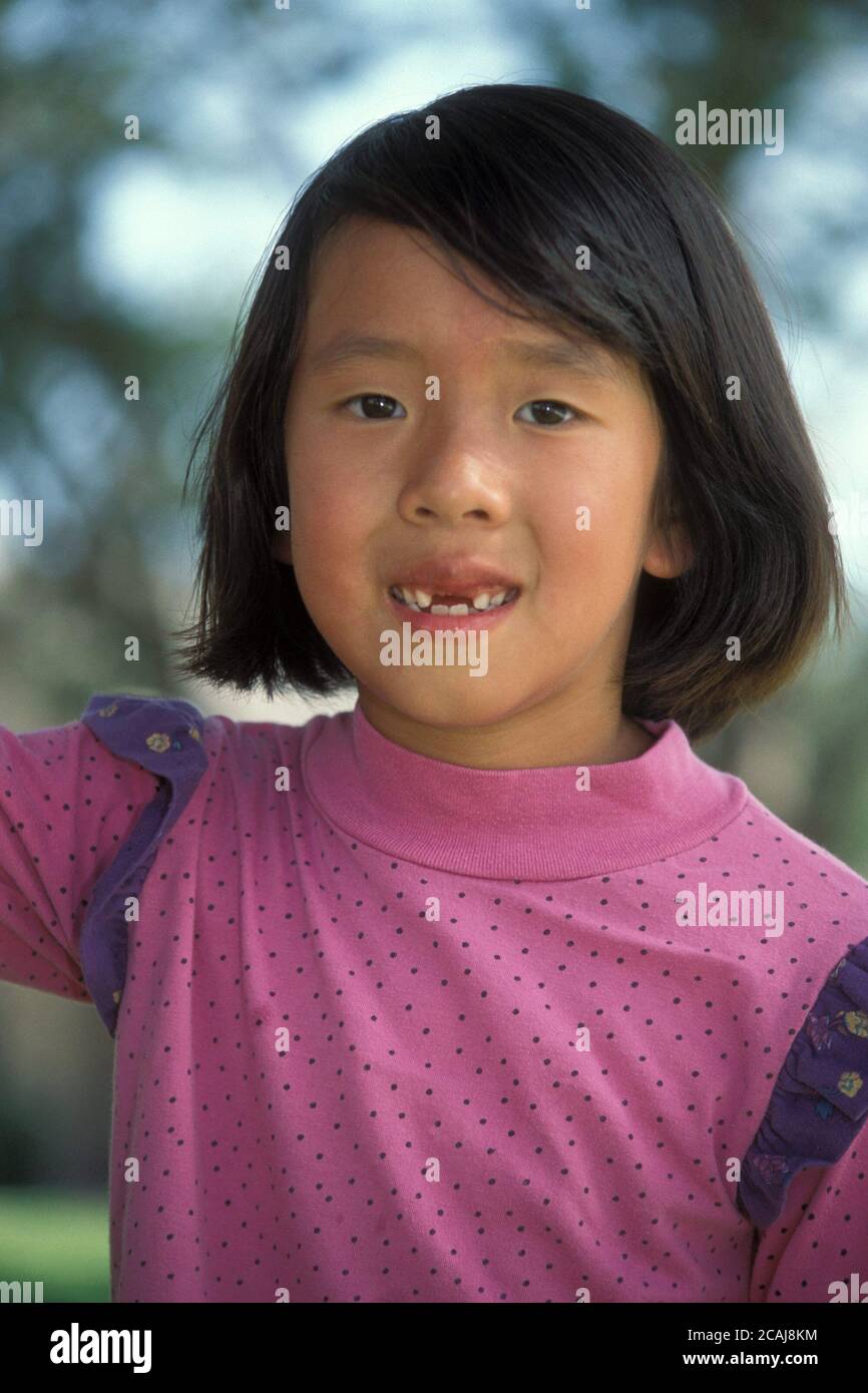 Portrait of seven-year-old Asian-American girl in park in Austin, Texas ...