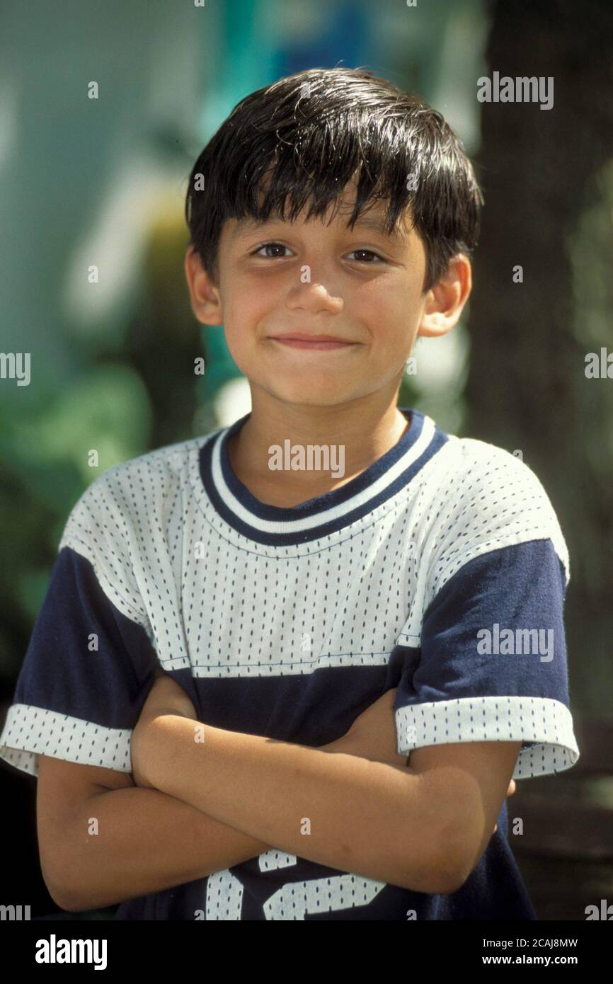 Portrait of eight-year-old Hispanic boy. Model Release. ©Bob Daemmrich ...