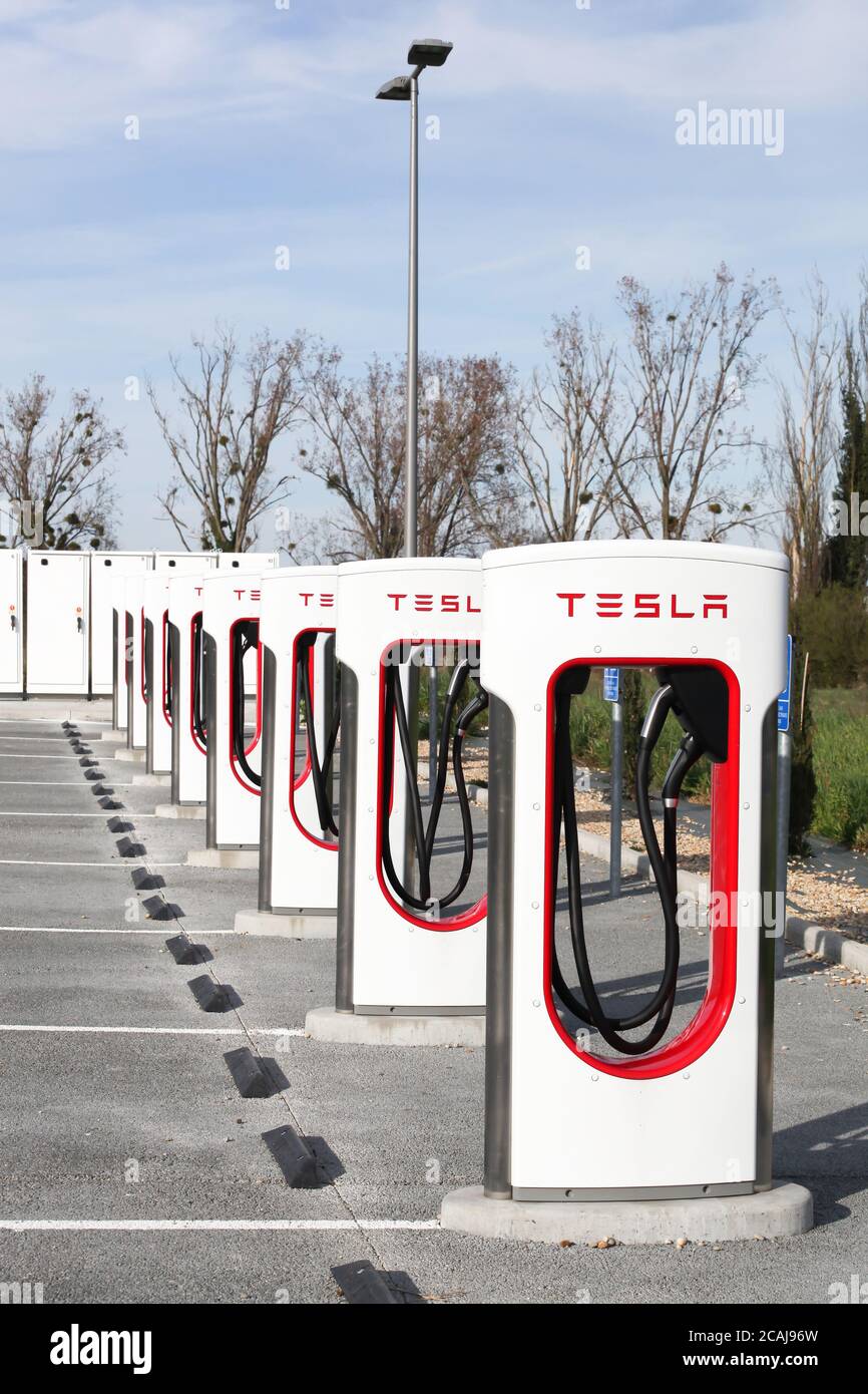 Sance, France - March 15, 2020: Tesla supercharger station. Tesla is an ...