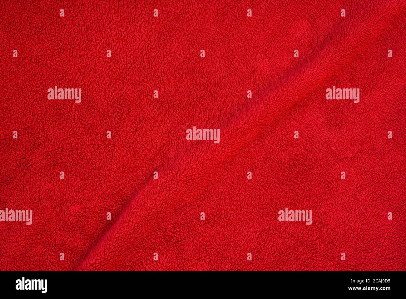 Terry pleated fabric texture. Red color Stock Photo - Alamy