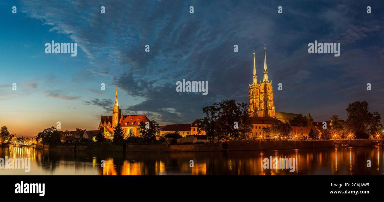 A cityscape cathedral, river Odra. Wroclaw, Poland, at dusk. Panorama ...