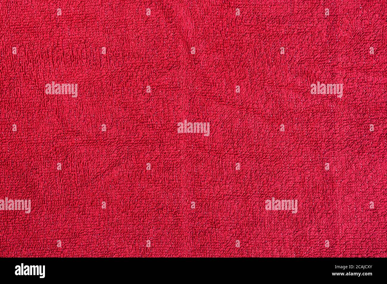 Smooth seamless texture of a terry towel. Red color Stock Photo - Alamy