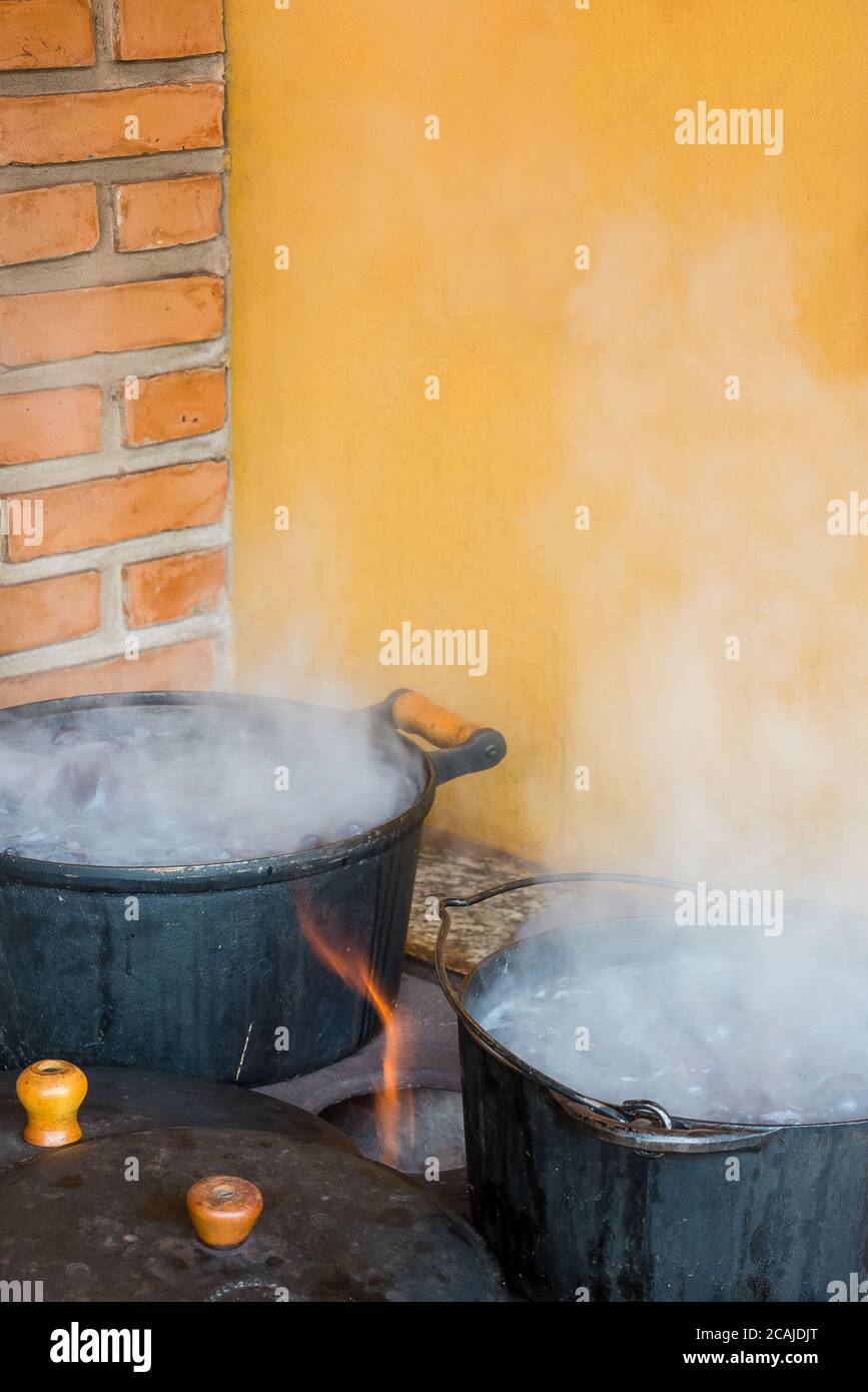 Black pots on wood fire hi-res stock photography and images - Alamy