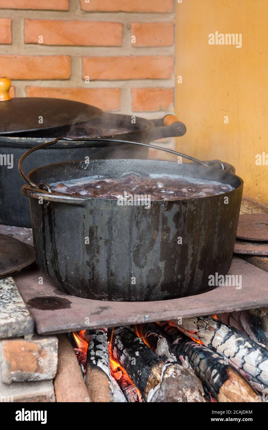 Black pots on wood fire hi-res stock photography and images - Alamy