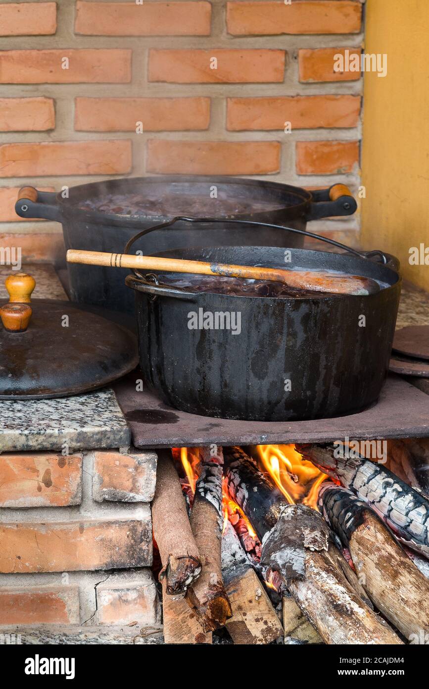 Pots and pans on the stove over a natural fire for cooking Stock Photo ...