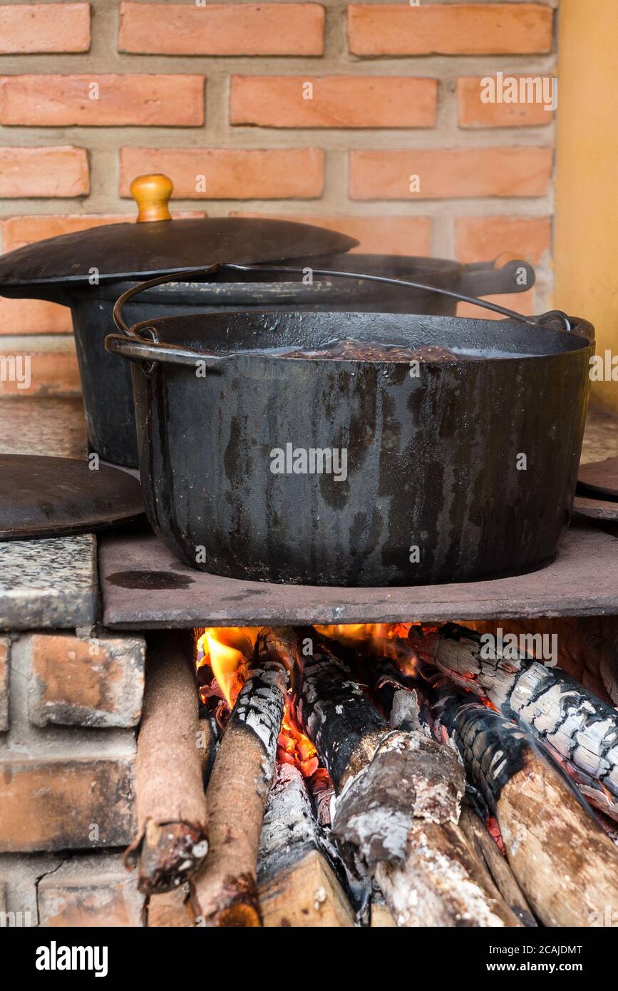 Pots and pans on the stove over a natural fire for cooking Stock Photo ...
