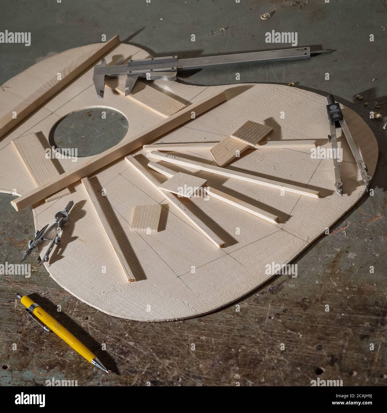 Classical guitar under construction in luthier workshop Stock Photo - Alamy