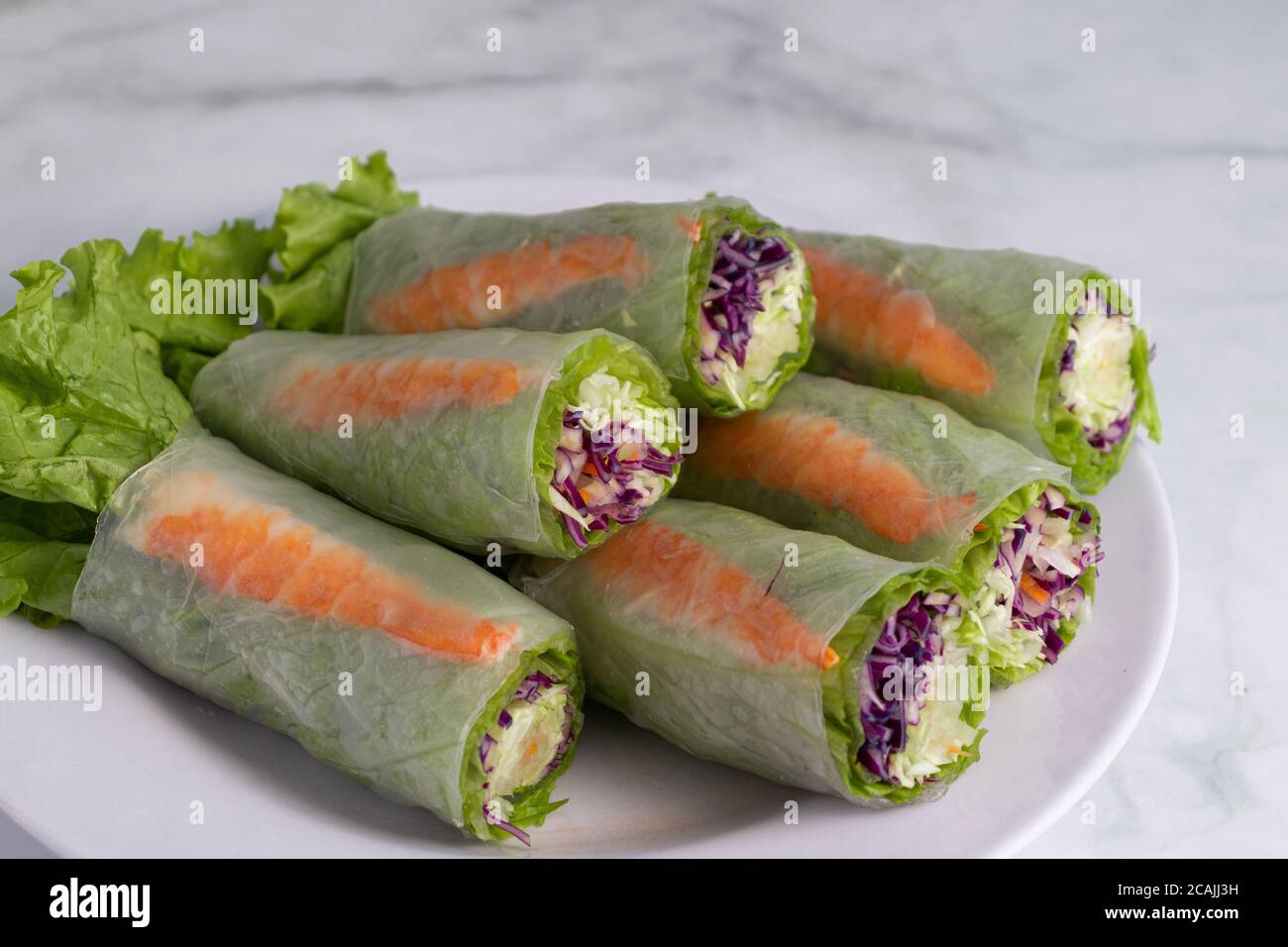 Closeup of Vietnamese spring rolls on a white plate Stock Photo - Alamy