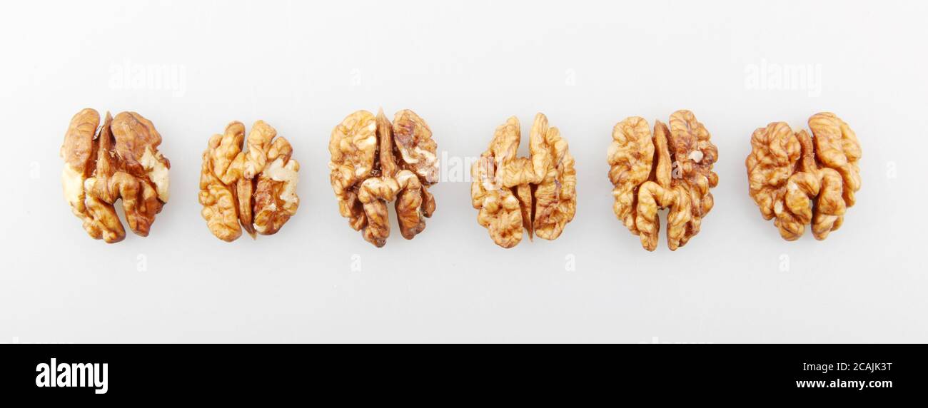 Cracked brown walnuts isolated on the white background Stock Photo - Alamy