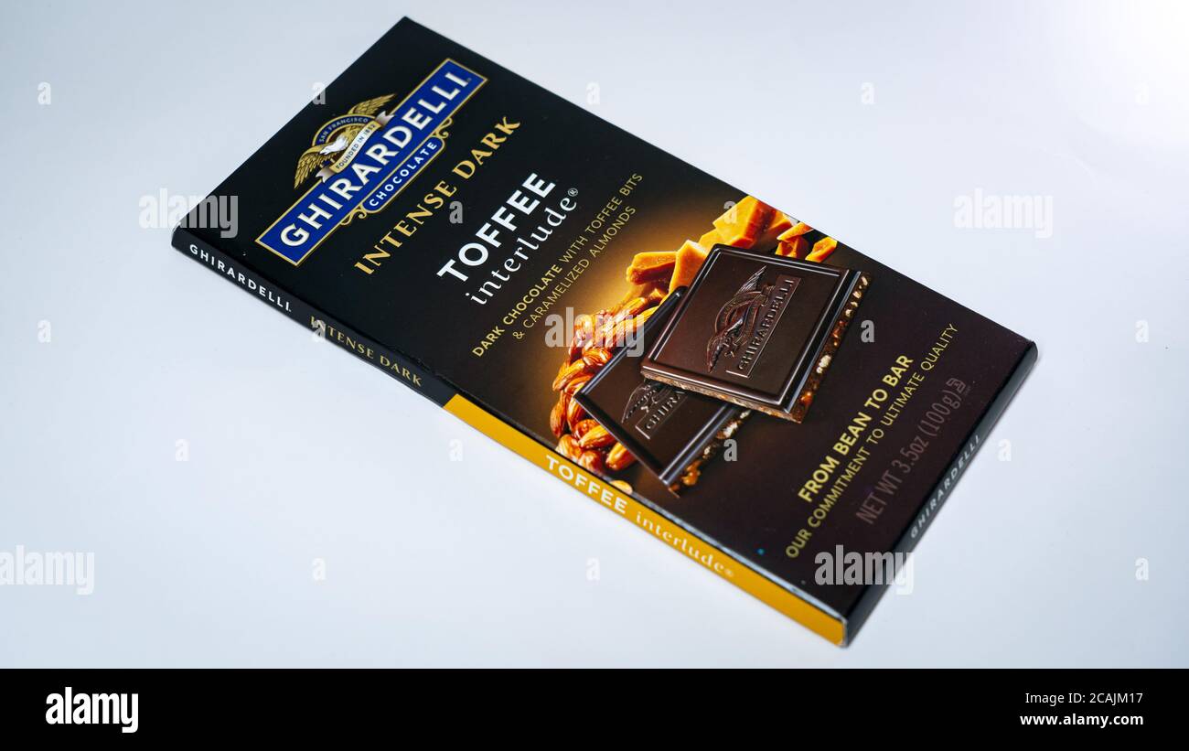 A bar of Ghirardelli Chocolate Intense Dark, Toffee Interlude bar on a ...