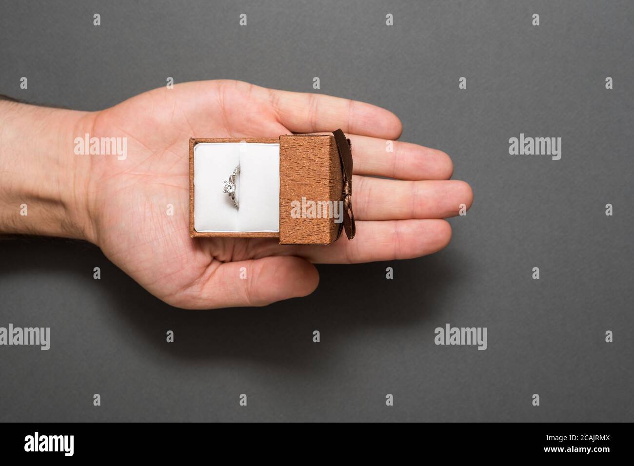 Ring in box hand top view hi-res stock photography and images - Alamy