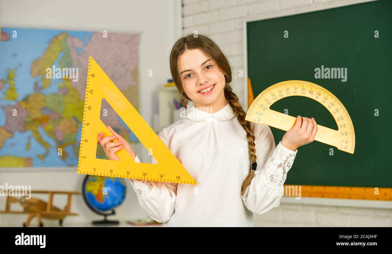 Small child holding ruler for mathematics lesson. Mathematics matters ...
