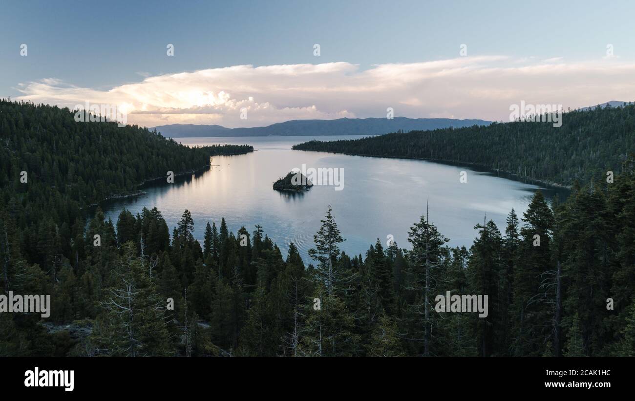 Beautiful scenery of clear waters of Lake Tahoe surrounded by woodland ...