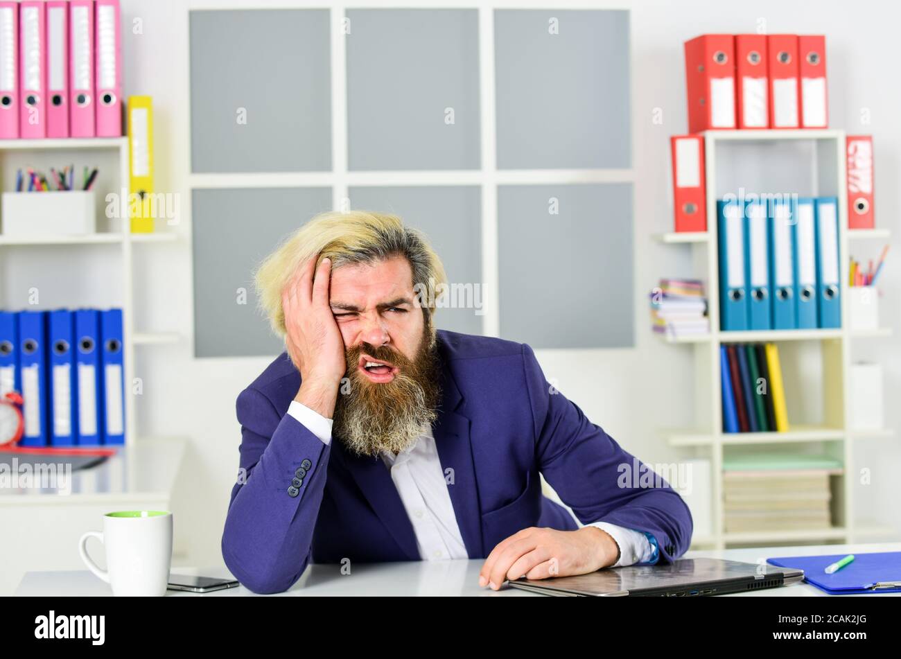 exhausted bearded ceo in jacket. tired man manager a workplace. mature ...