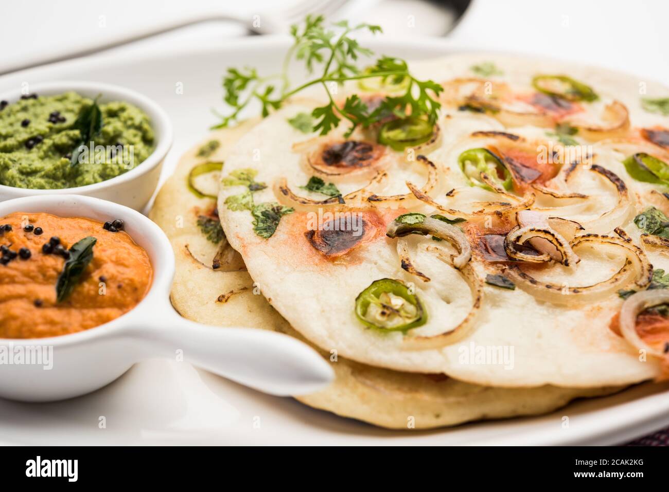 Uthappam or uttapam is a type of dosa from South India which is thicker ...