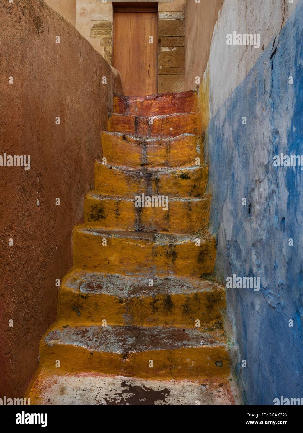 Yellow stone staircase between two stone walls, abstract art background ...