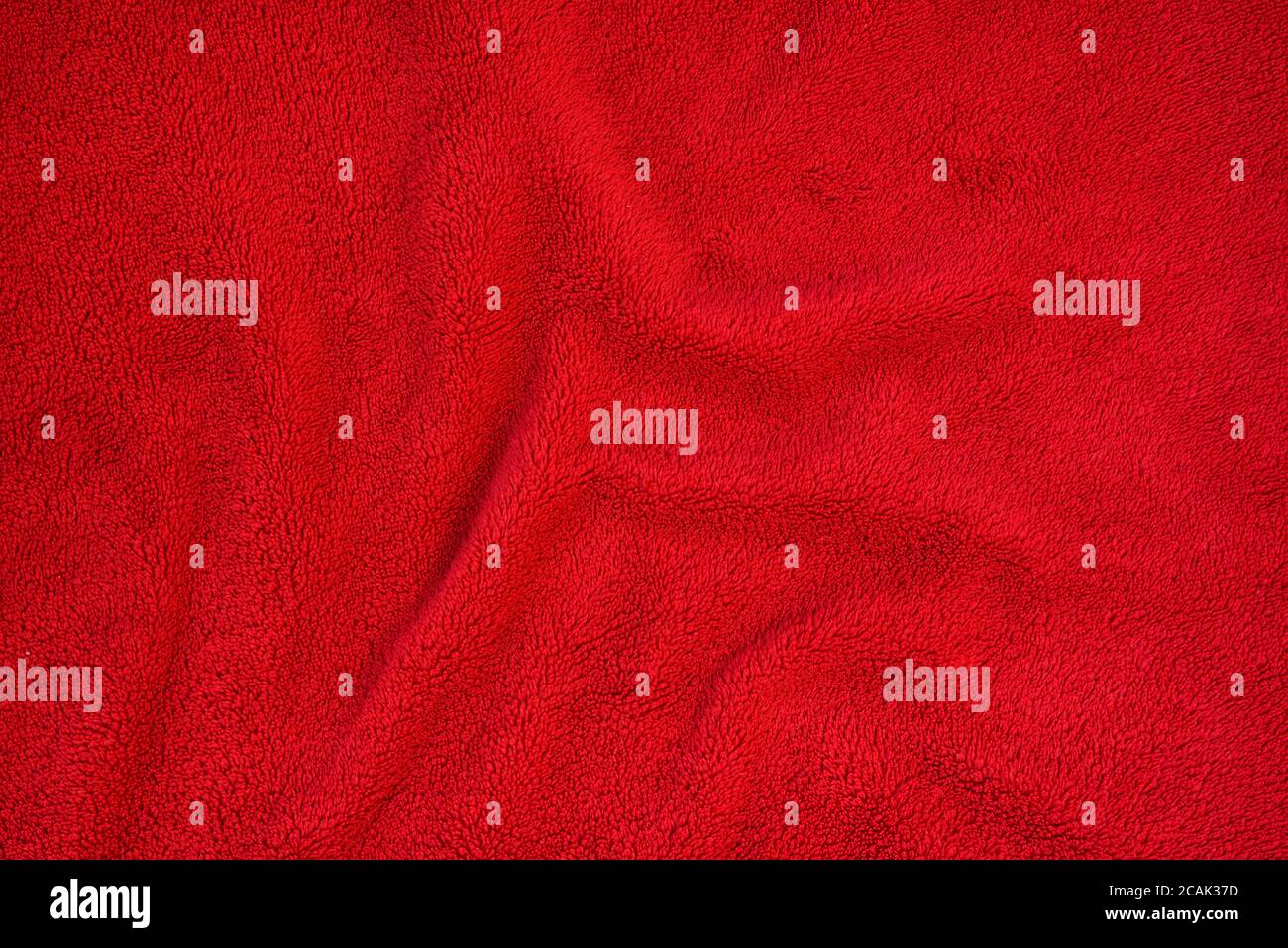 Terry pleated fabric texture. Red color Stock Photo - Alamy