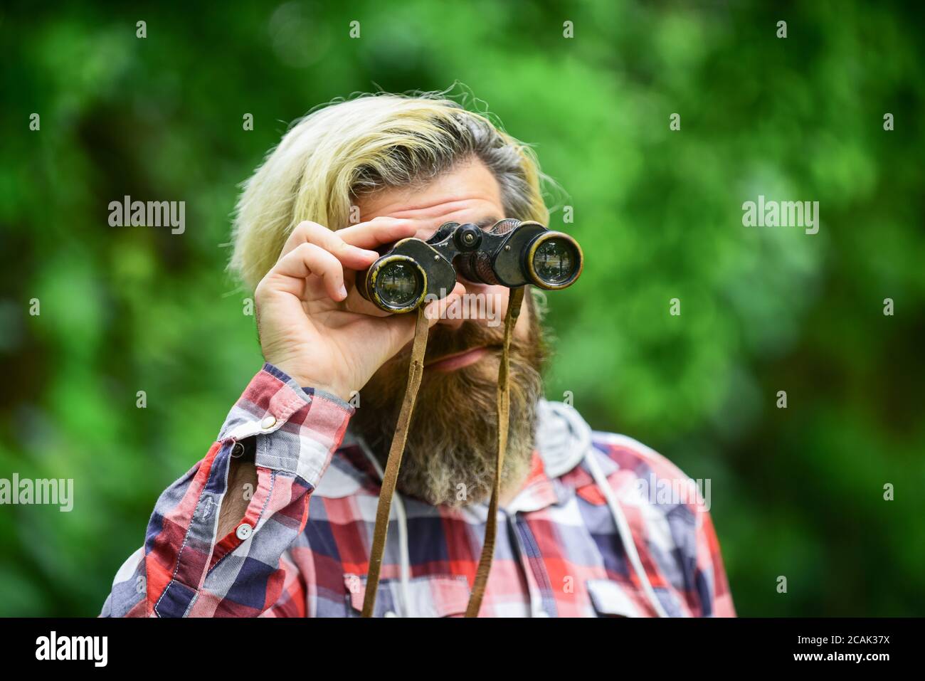 Observing nature. Man ornithology expedition in forest. Man observing ... Observing nature. Man ornithology expedition in forest. Man observing ...
