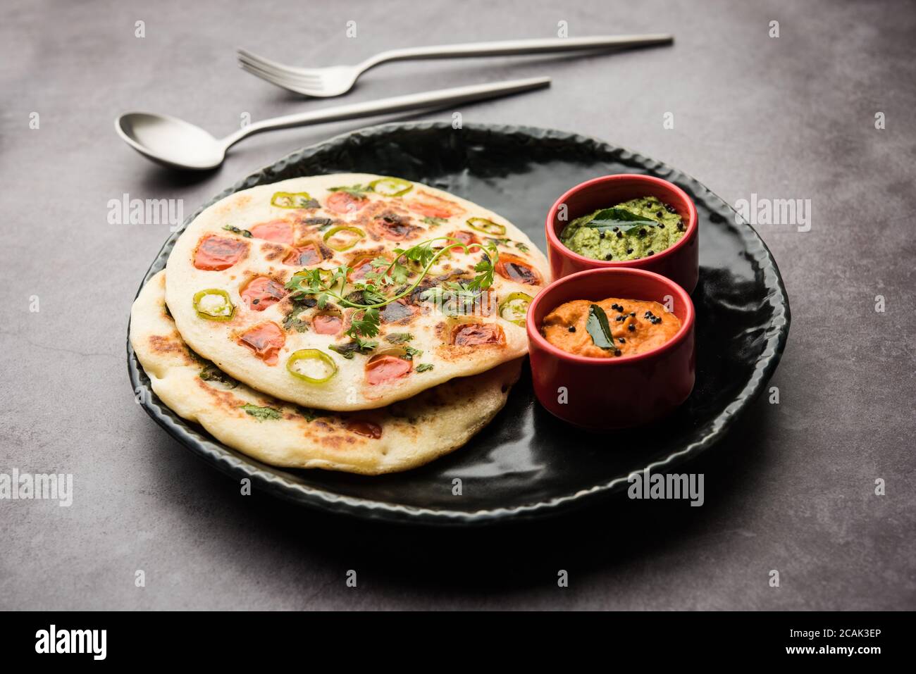 Tomato uttapam hi-res stock photography and images - Alamy