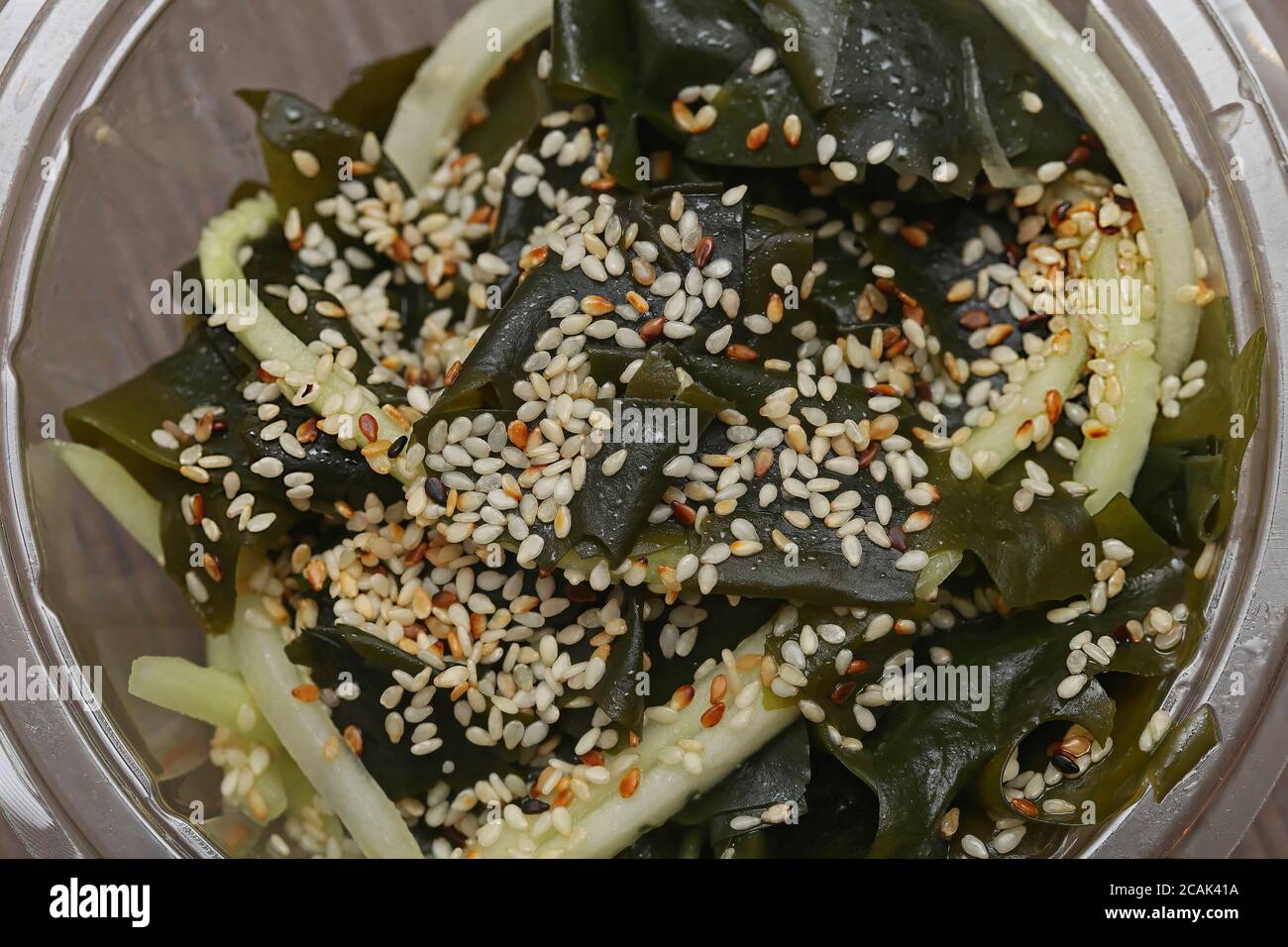 Healthy green seaweed algae salad with sesame seeds Stock Photo - Alamy