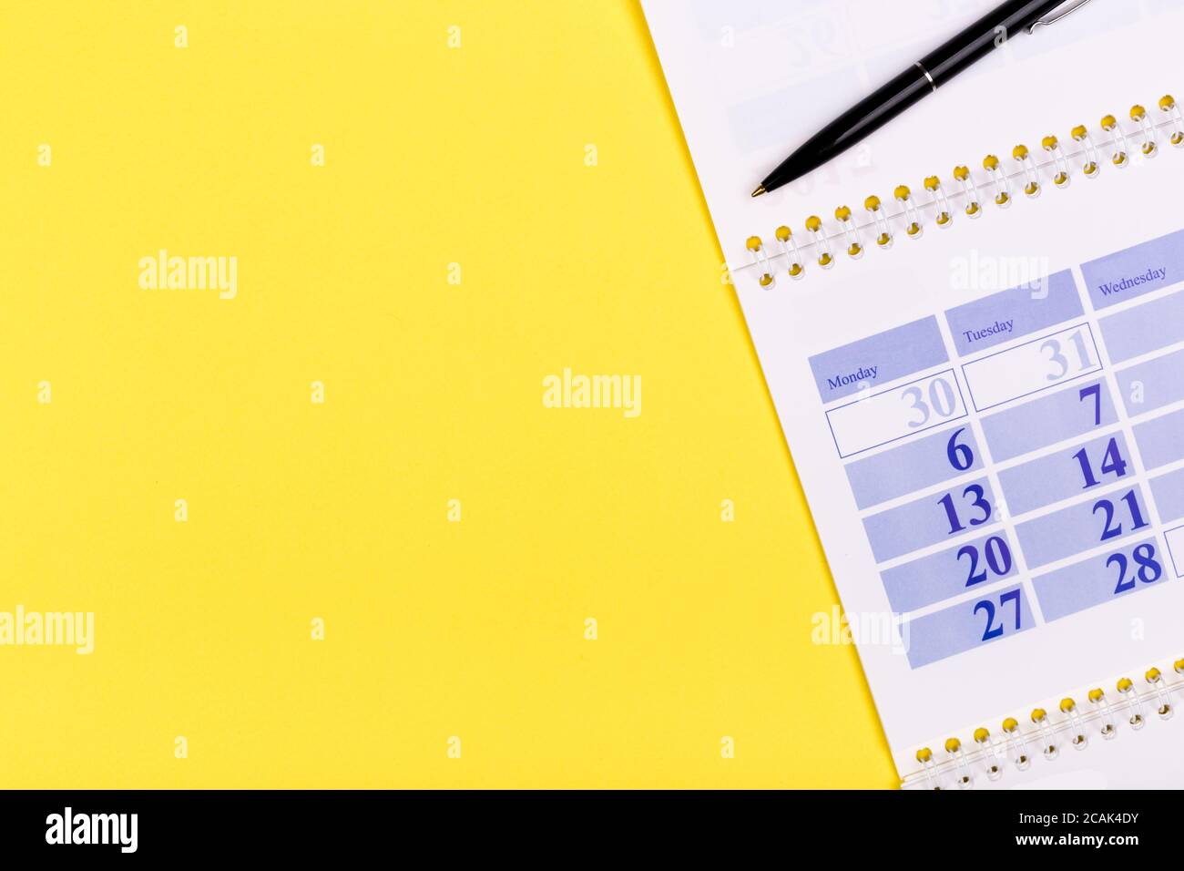 White clean calendar on solid yellow background with copy space ...