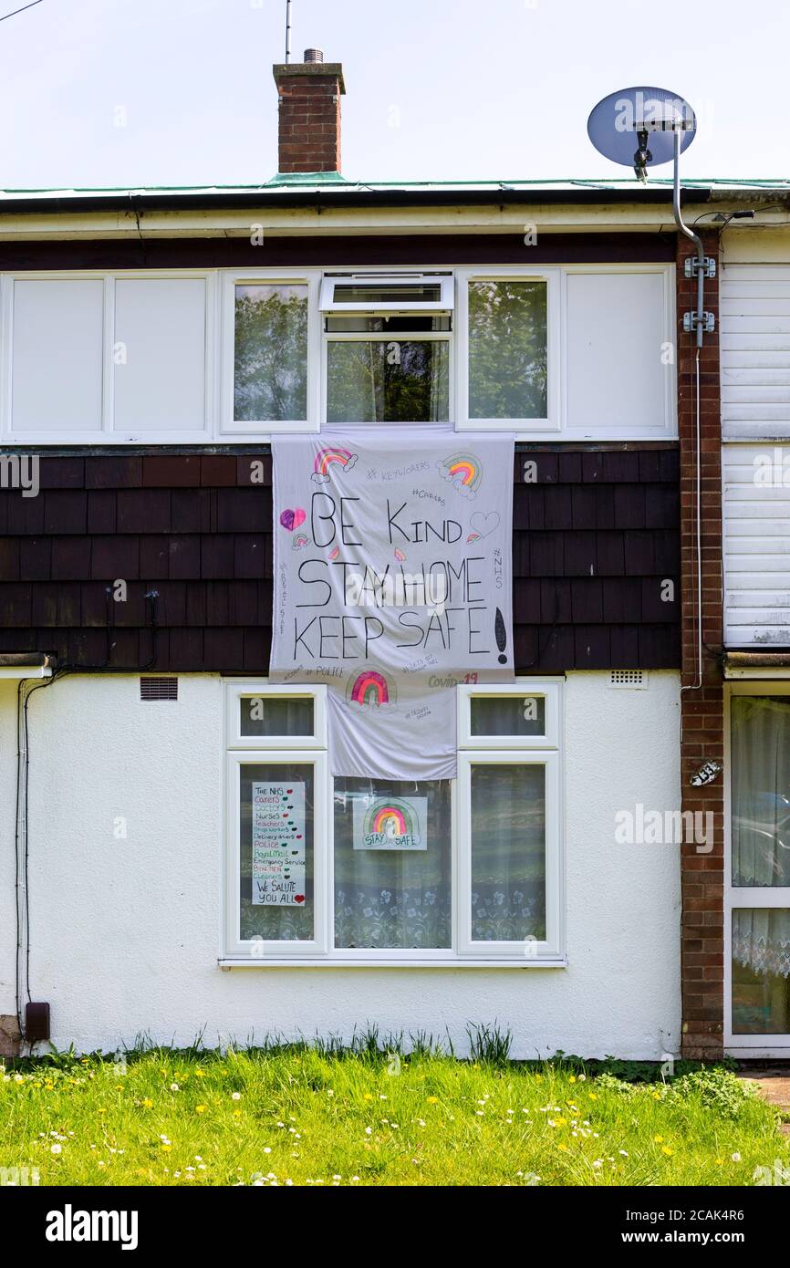 Stay home message seen at the window of a house in Cambridge, UK ...