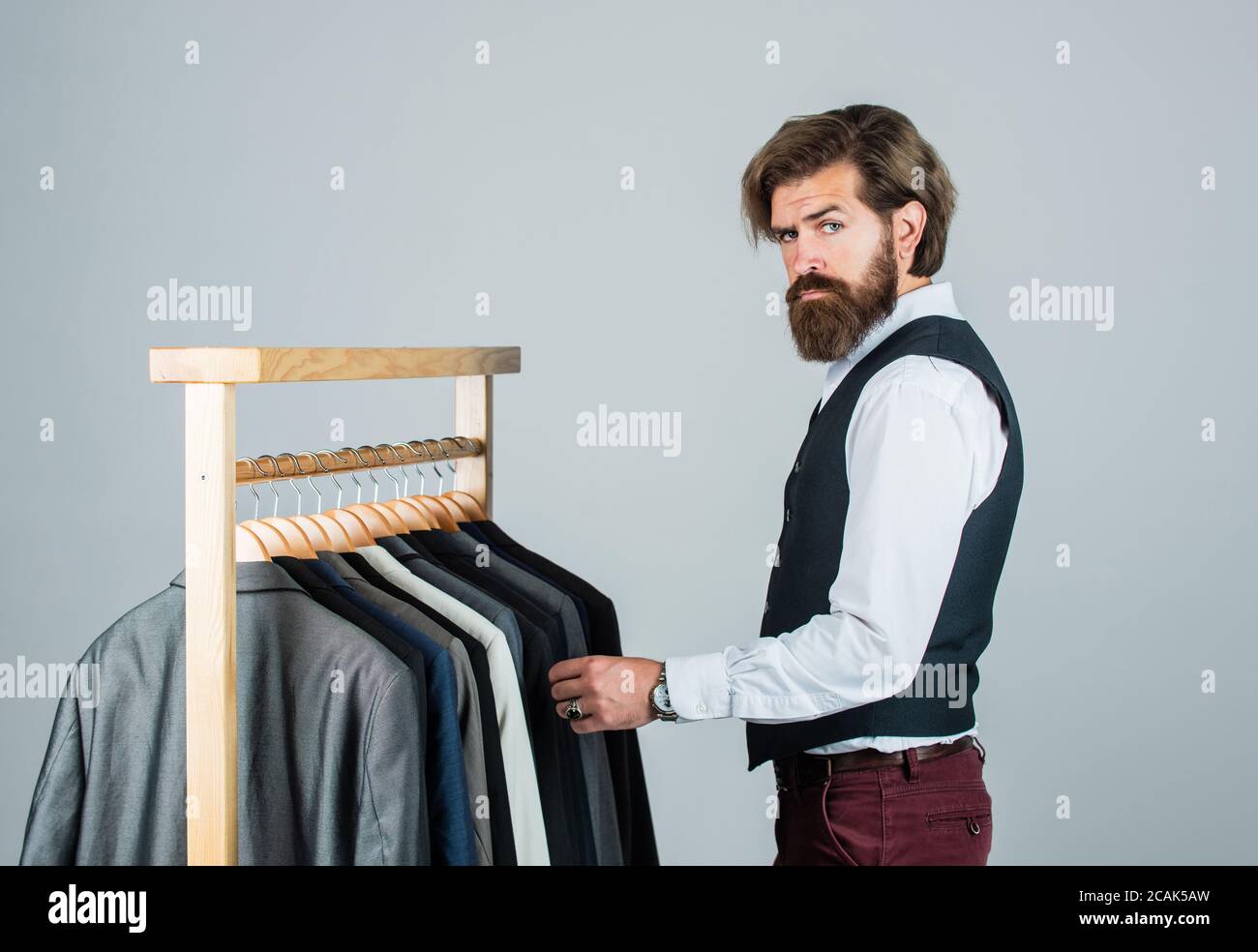 Man in custom tailored suit presenting expensive tailored tuxedo. Man ...